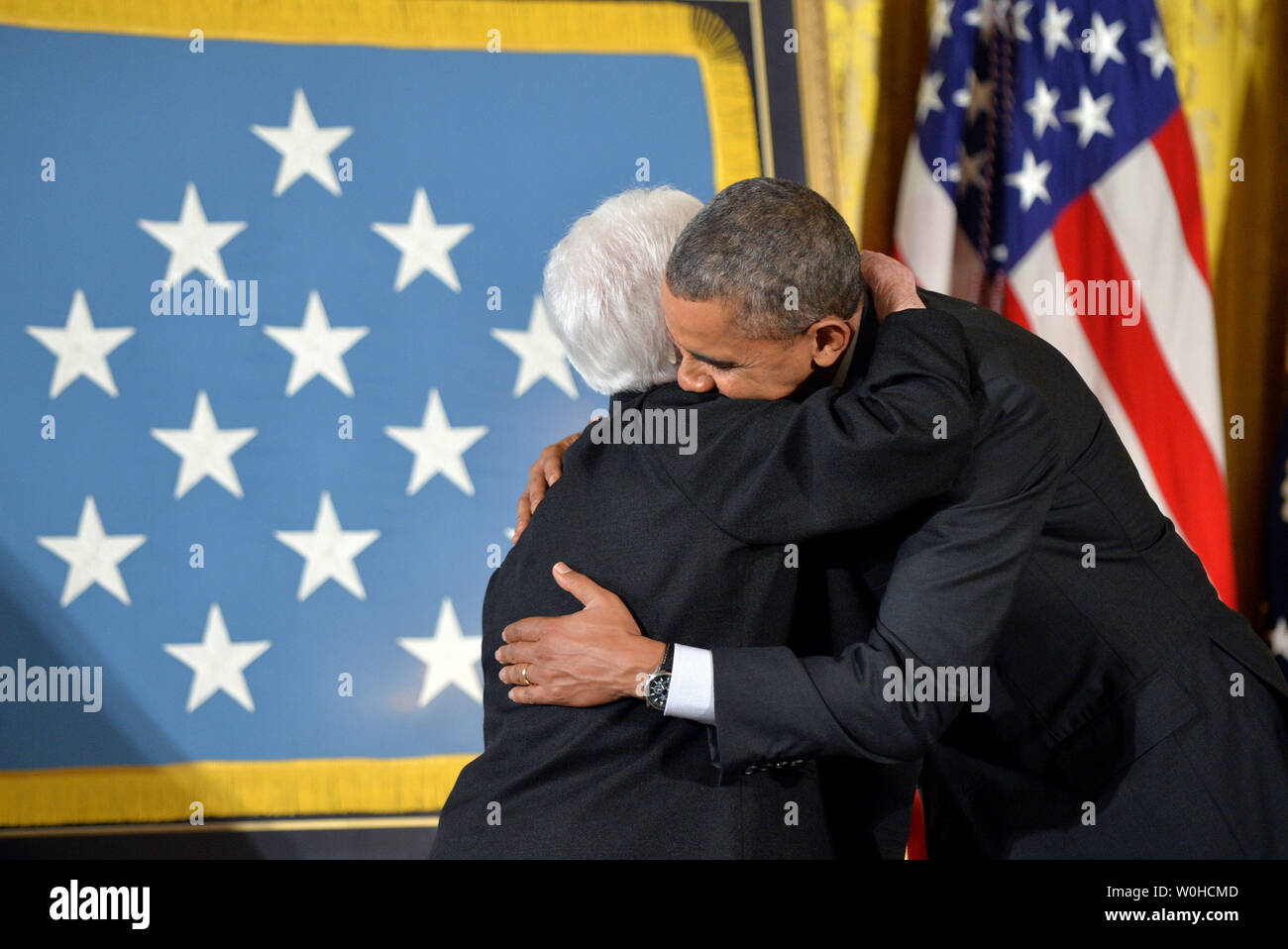 President Barack Obama hugs Nancy Weinstein as she accepts the Medal of ...