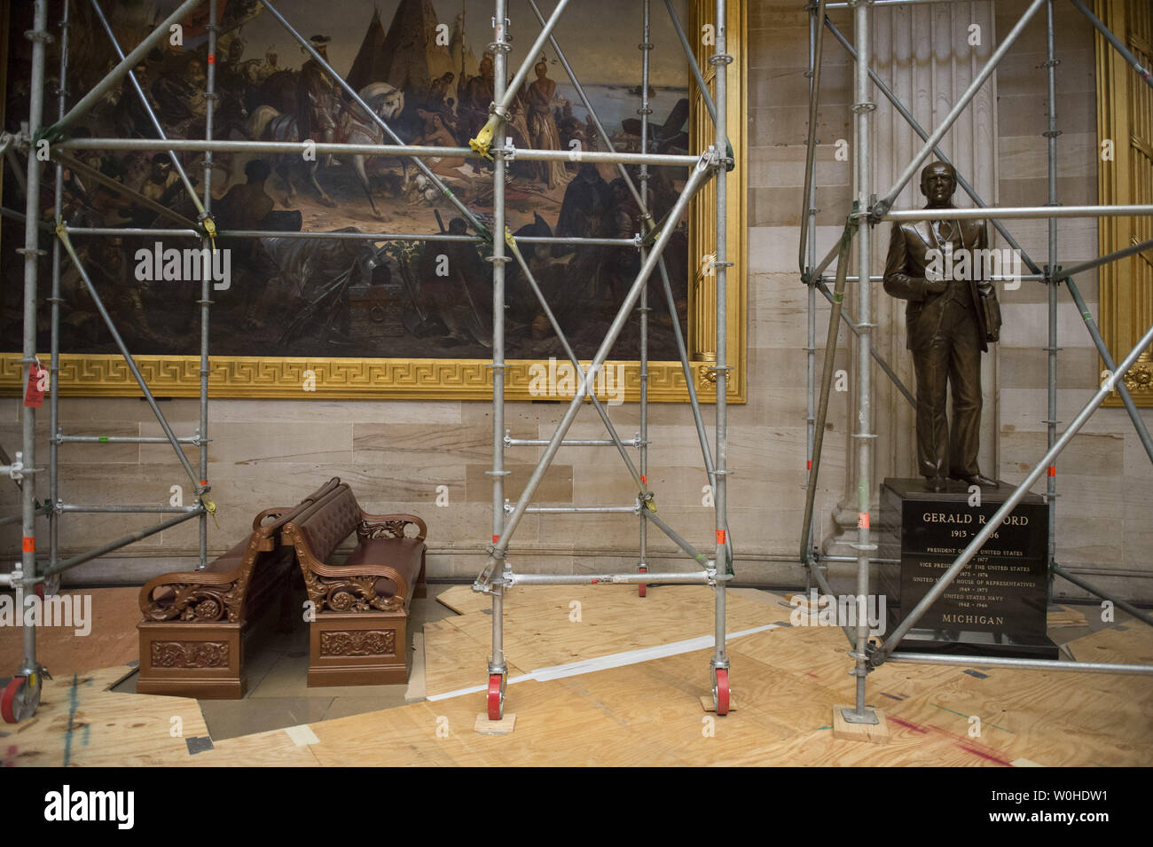 A statue of President Gerald Ford is seen surrounded by scaffolding in ...