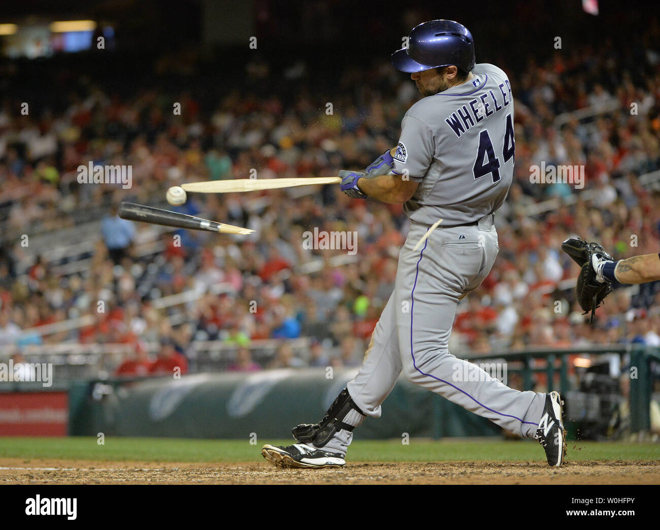 Colorado Rockies Ryan Wheeler breaks his bat as he connects against the Washington Nationals at ...