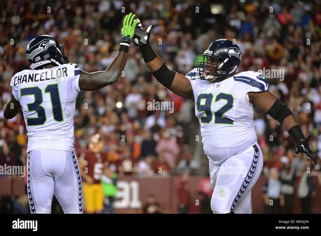 Seattle Seahawks strong safety Kam Chancellor (31) and Brandon Mebane ...