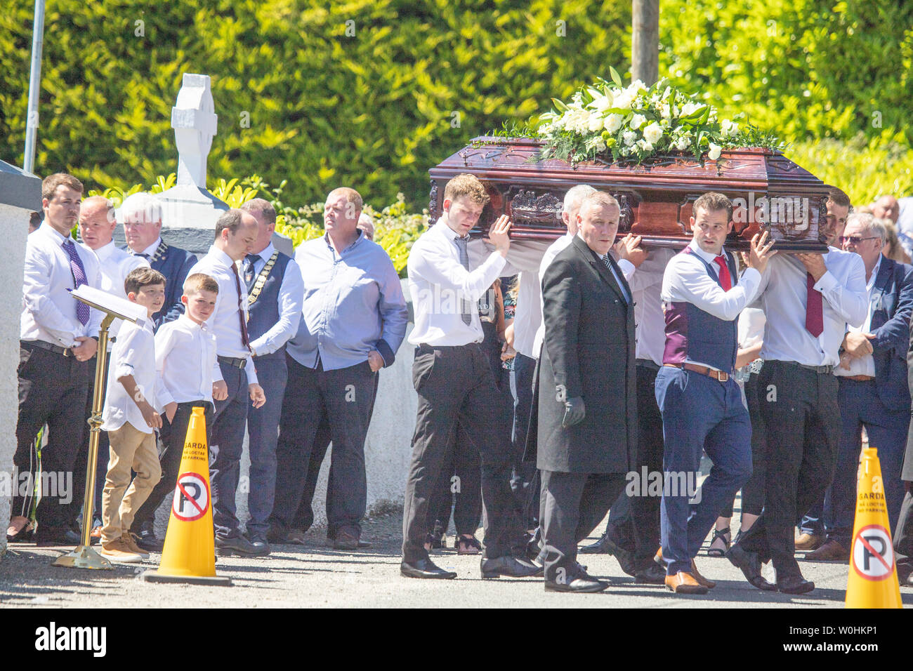 The coffin of rally driver Manus Kelly is taken from St Columba's ...
