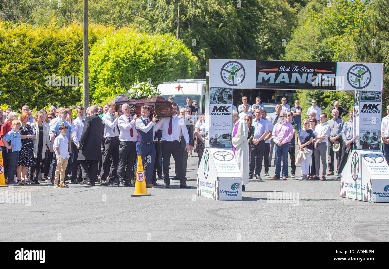 The coffin of rally driver Manus Kelly is taken from St Columba's ...