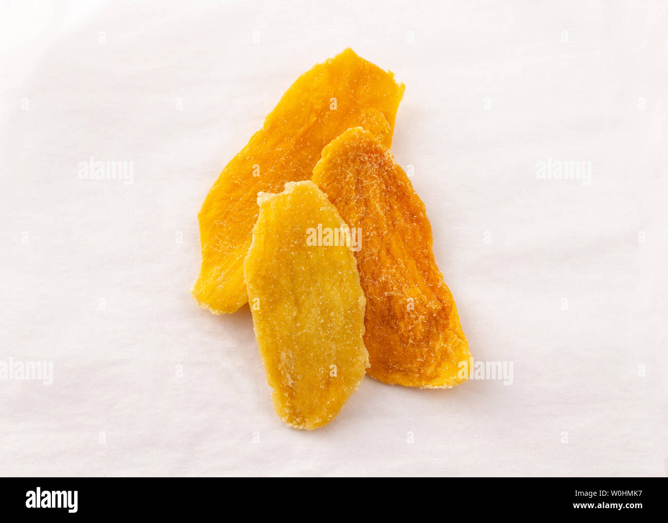 dried mango on white background Stock Photo - Alamy