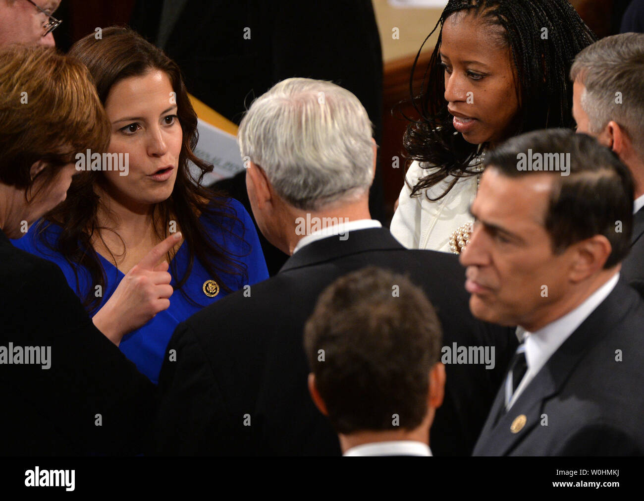 Rep. Elise Stefanik (L), R-N.Y., talks to fellow members during the ...