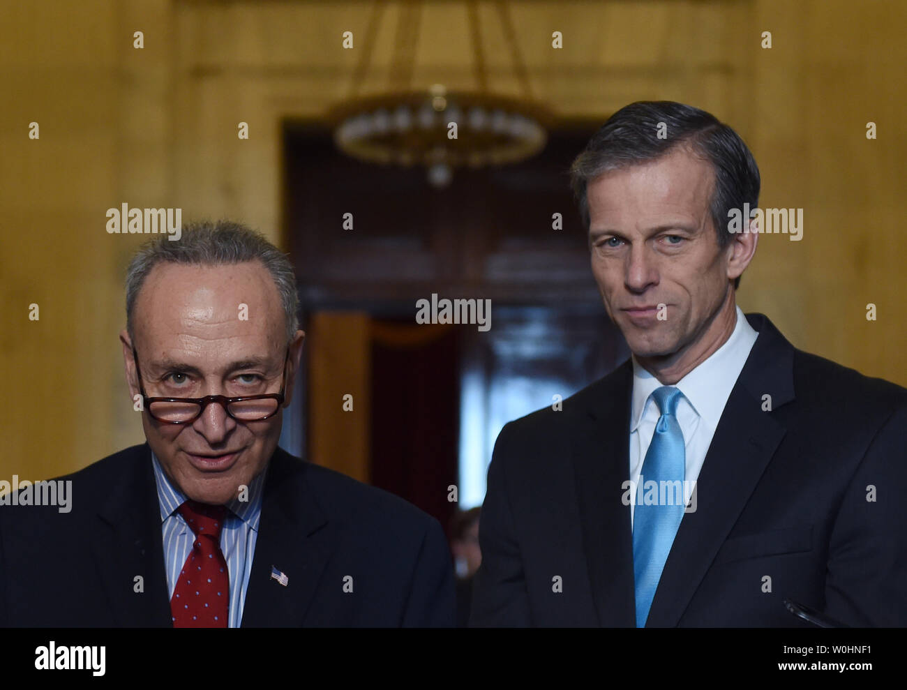 Sen. Charles Schumer (Left) (D-NY) speaks next to Sen. John Thune (R-SD ...