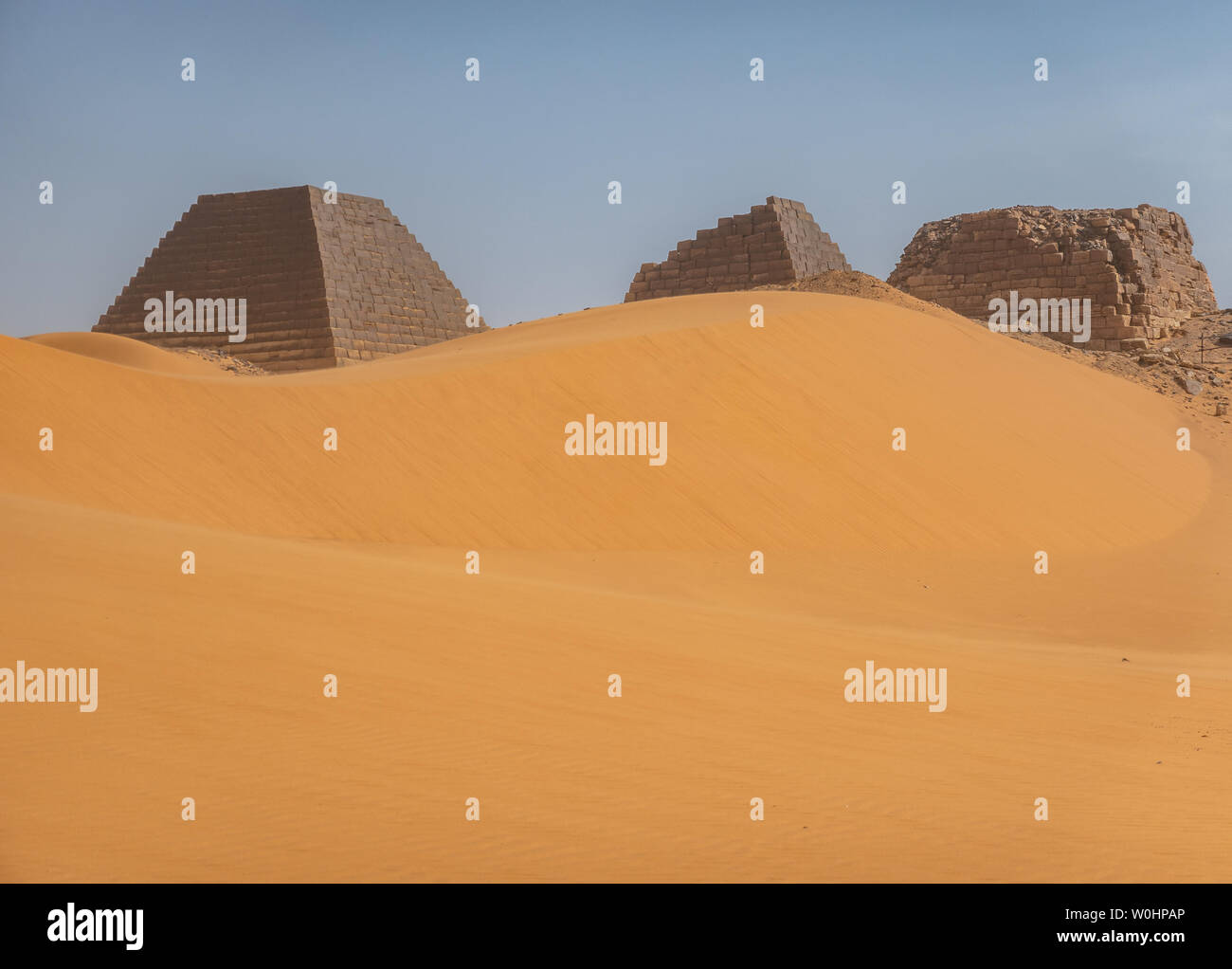 Pyramids behind a large sand dune in the desert of Sudan, Africa Stock ...