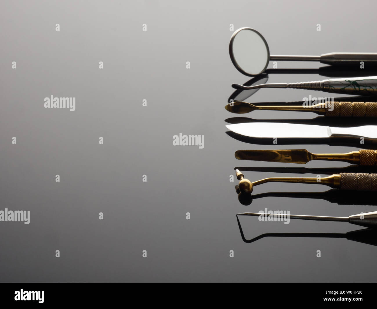 Medical dental tools on gray gradient background Stock Photo - Alamy
