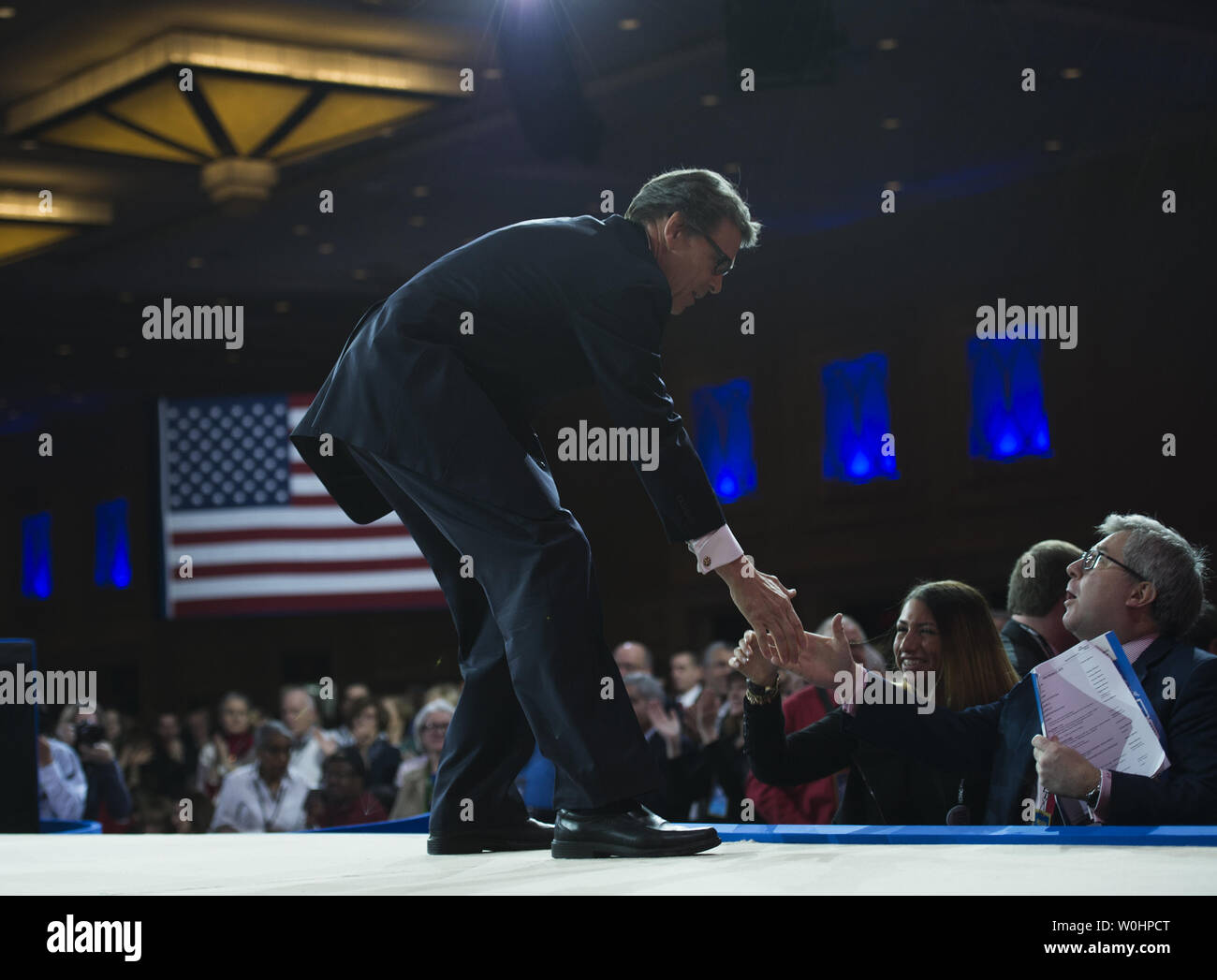 Texas Governor Rick Perry greets attendees after speaking at the ...