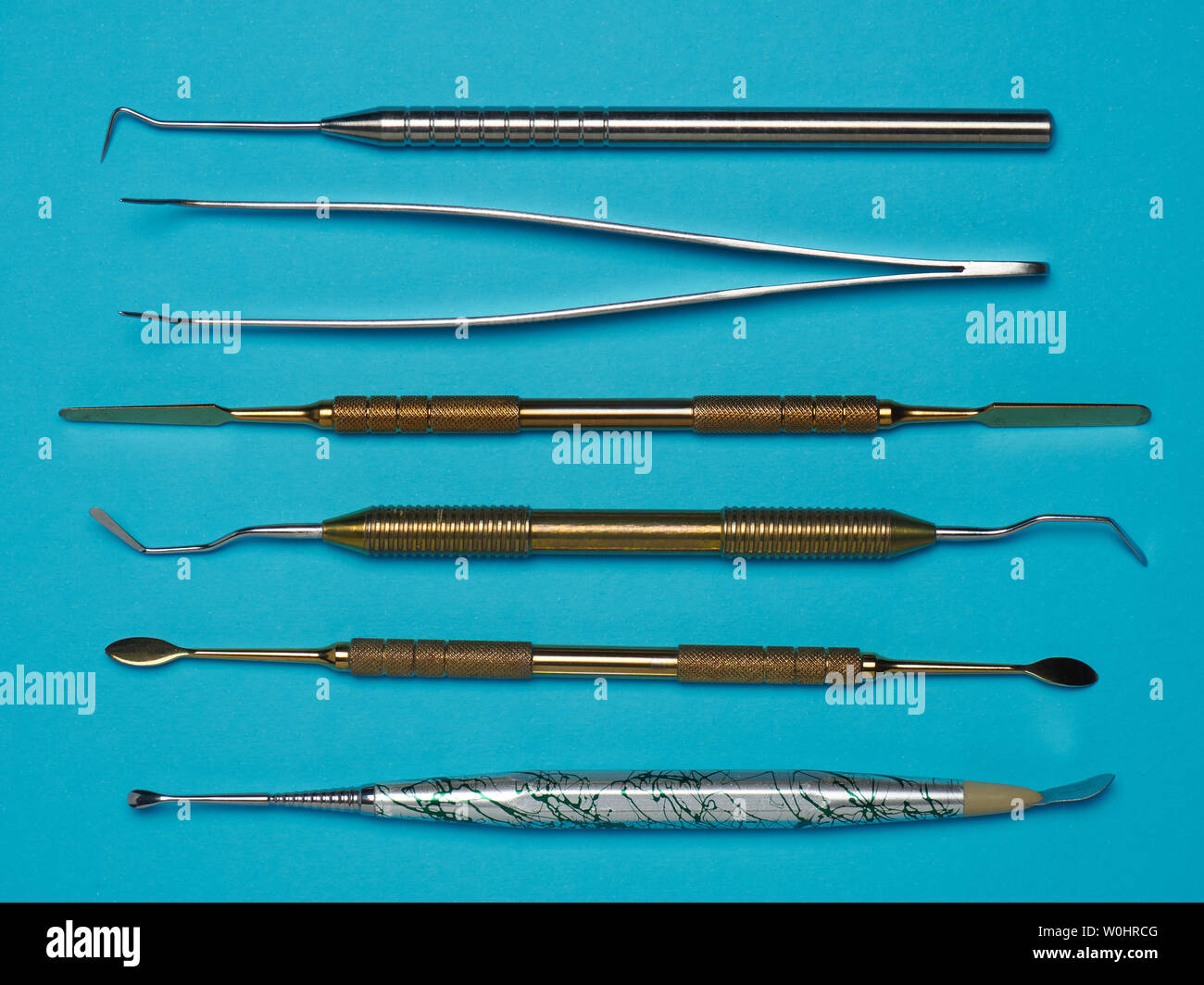 Professional dental tools on blue background. Dental health concept ...