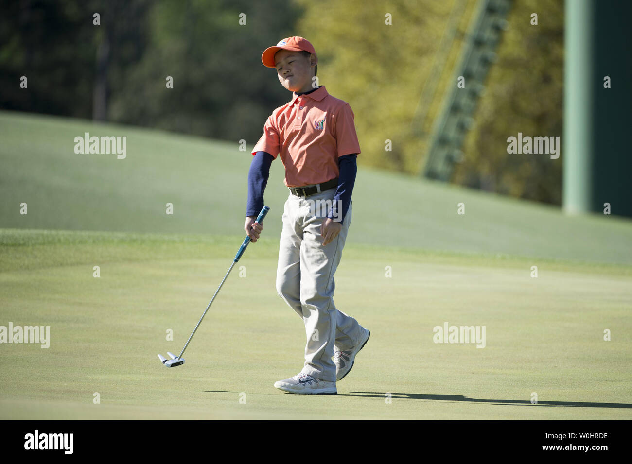 Daniel Zou of Humble, Texas reacts after missing a putt in the boys 7-9 ...