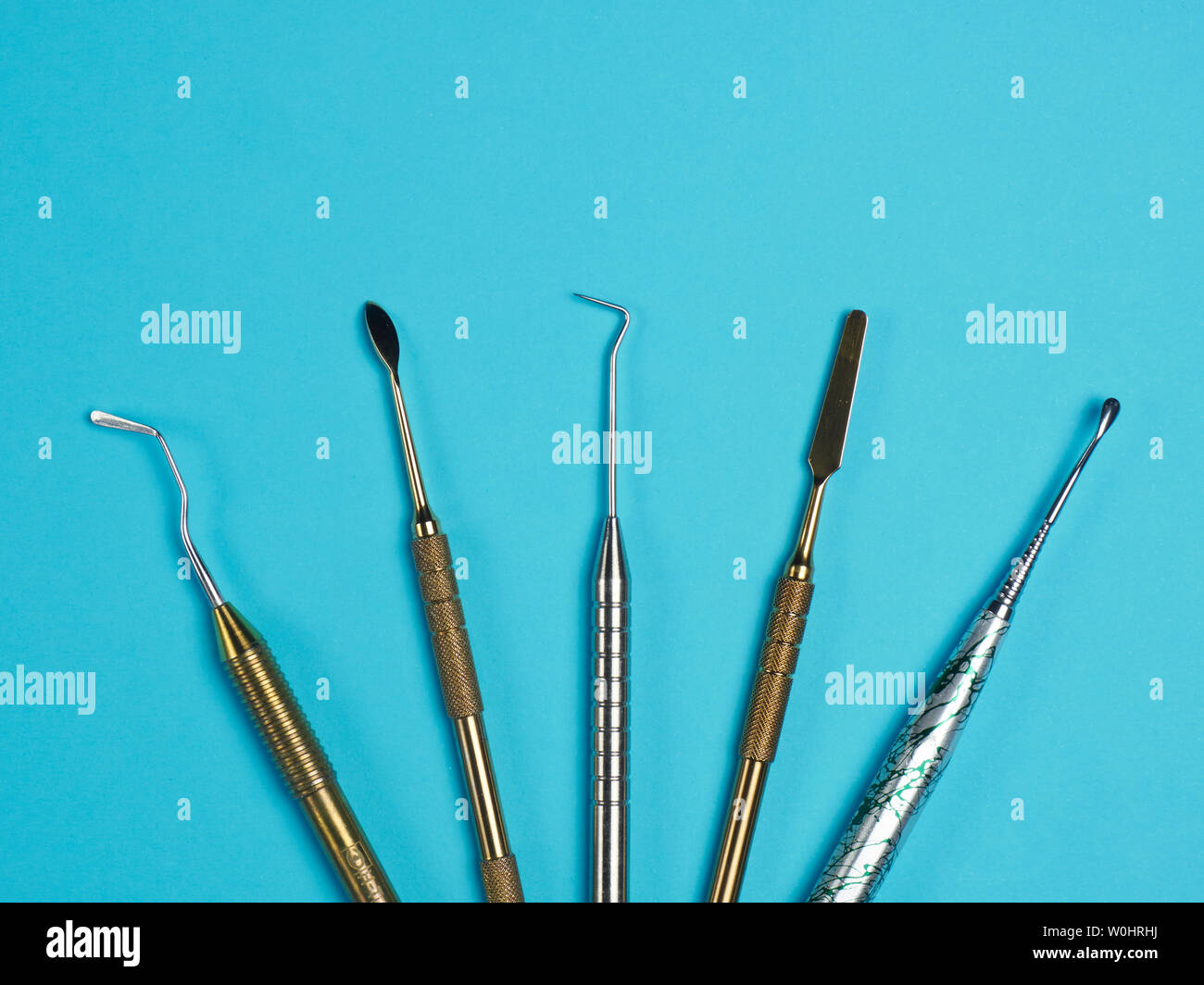 Professional dental tools on blue background Stock Photo - Alamy