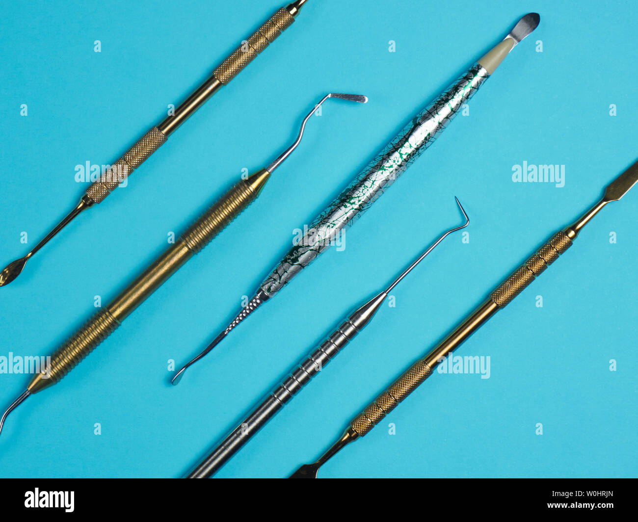Professional dental tools on blue background Stock Photo - Alamy
