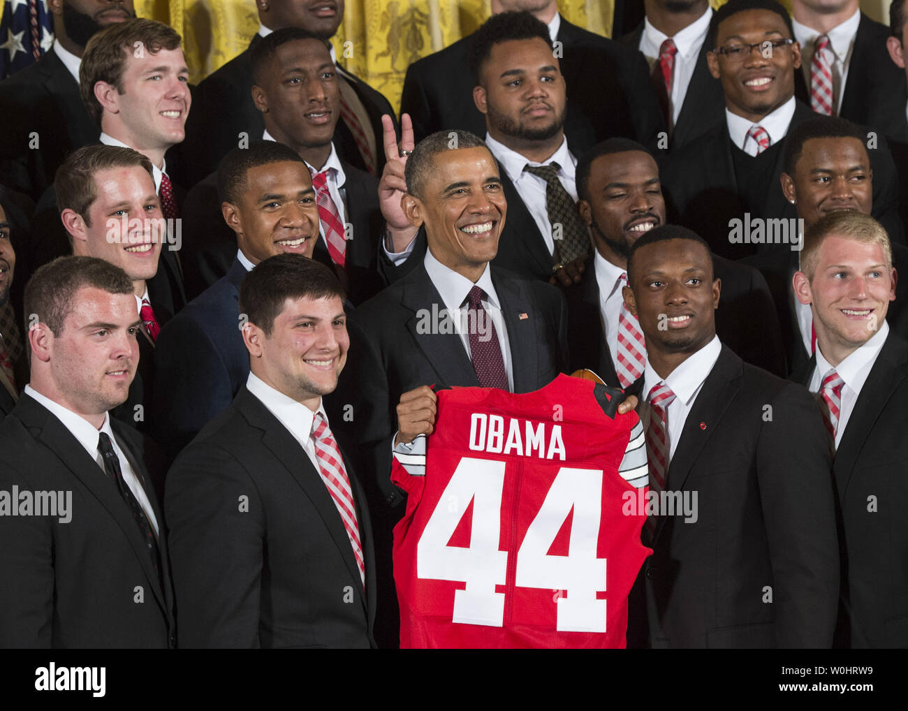 A member of the Ohio State University football makes a hand gesture ...