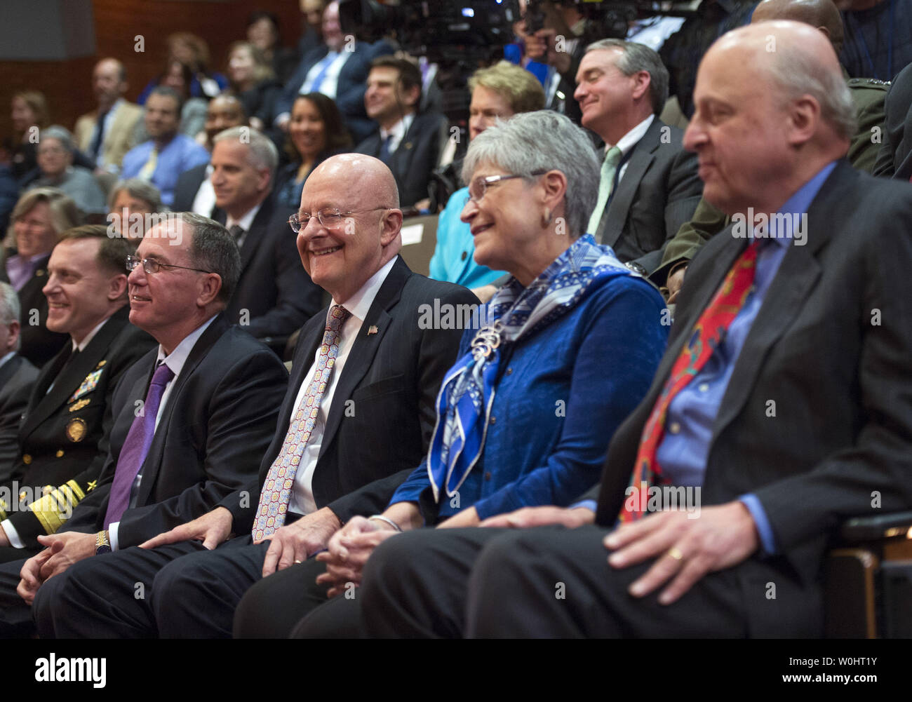 Director of National Intelligence James Clapper (center left) sits with ...