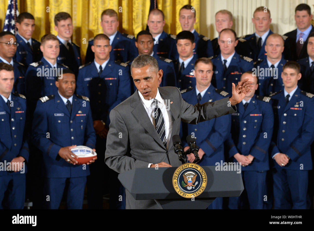 President Barack Obama presents the Commander-in-Chief Trophy to the ...