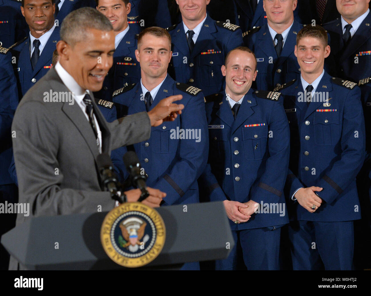 President Barack Obama presents the Commander-in-Chief Trophy to the ...