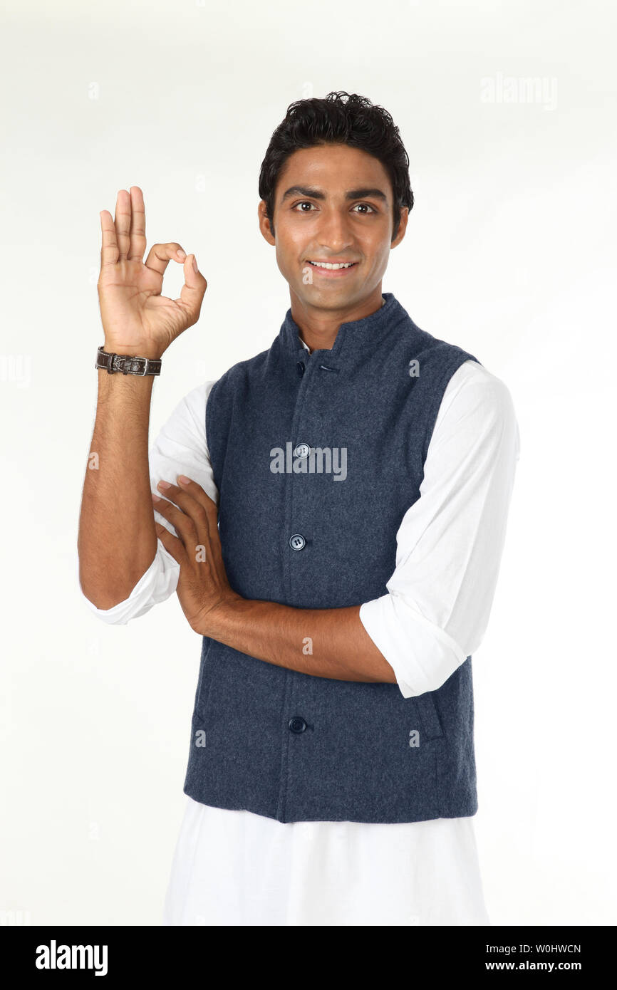 Portrait of a man showing ok sign Stock Photo - Alamy