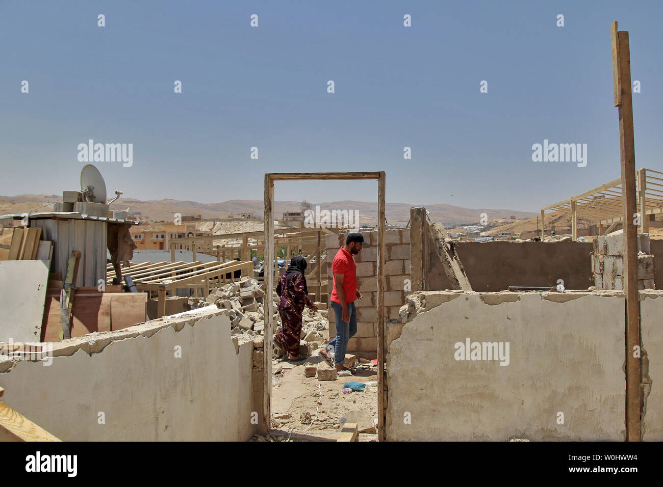 Aarsal, Lebanon. 27th June, 2019. Syrian refugees inspect demolished ...