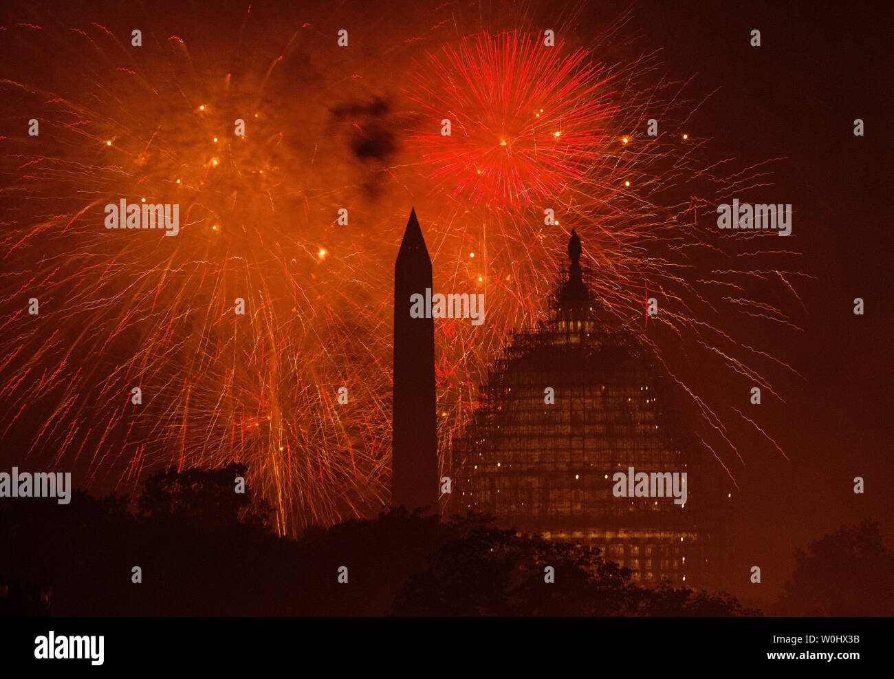 Fireworks explode over the National Mall in honor of Independence Day ...