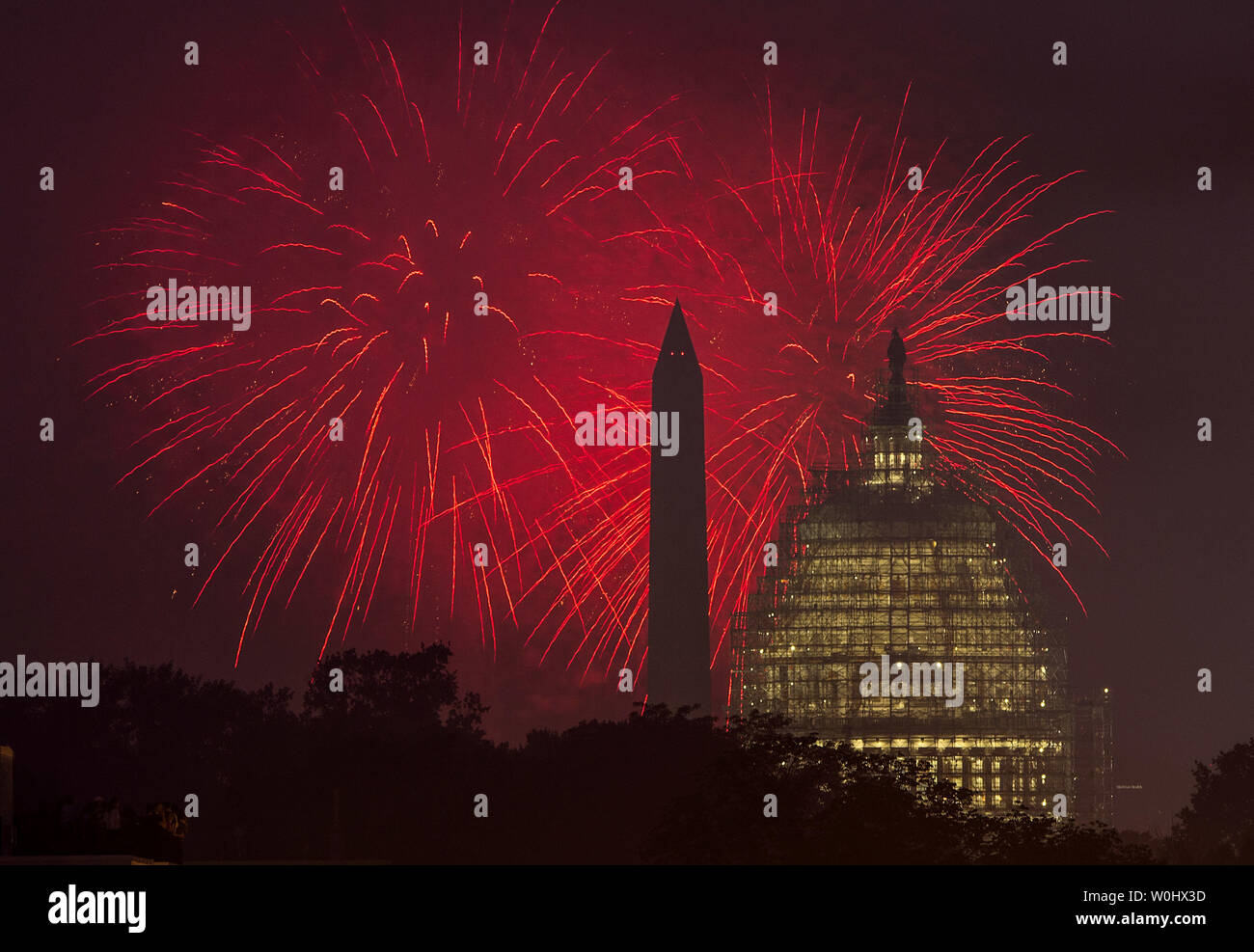 Fireworks explode over the National Mall in honor of Independence Day ...