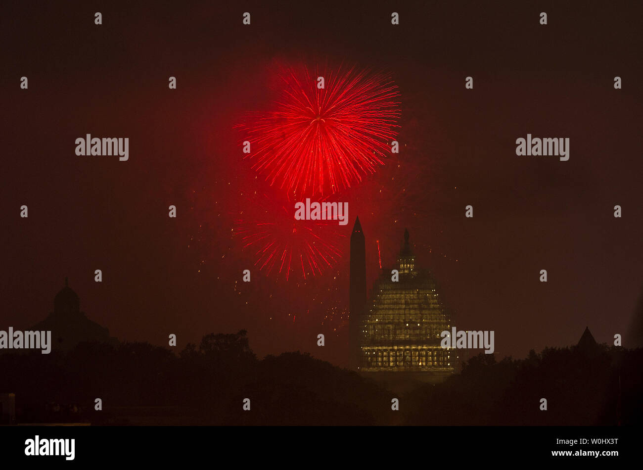 Fireworks explode over the National Mall in honor of Independence Day ...