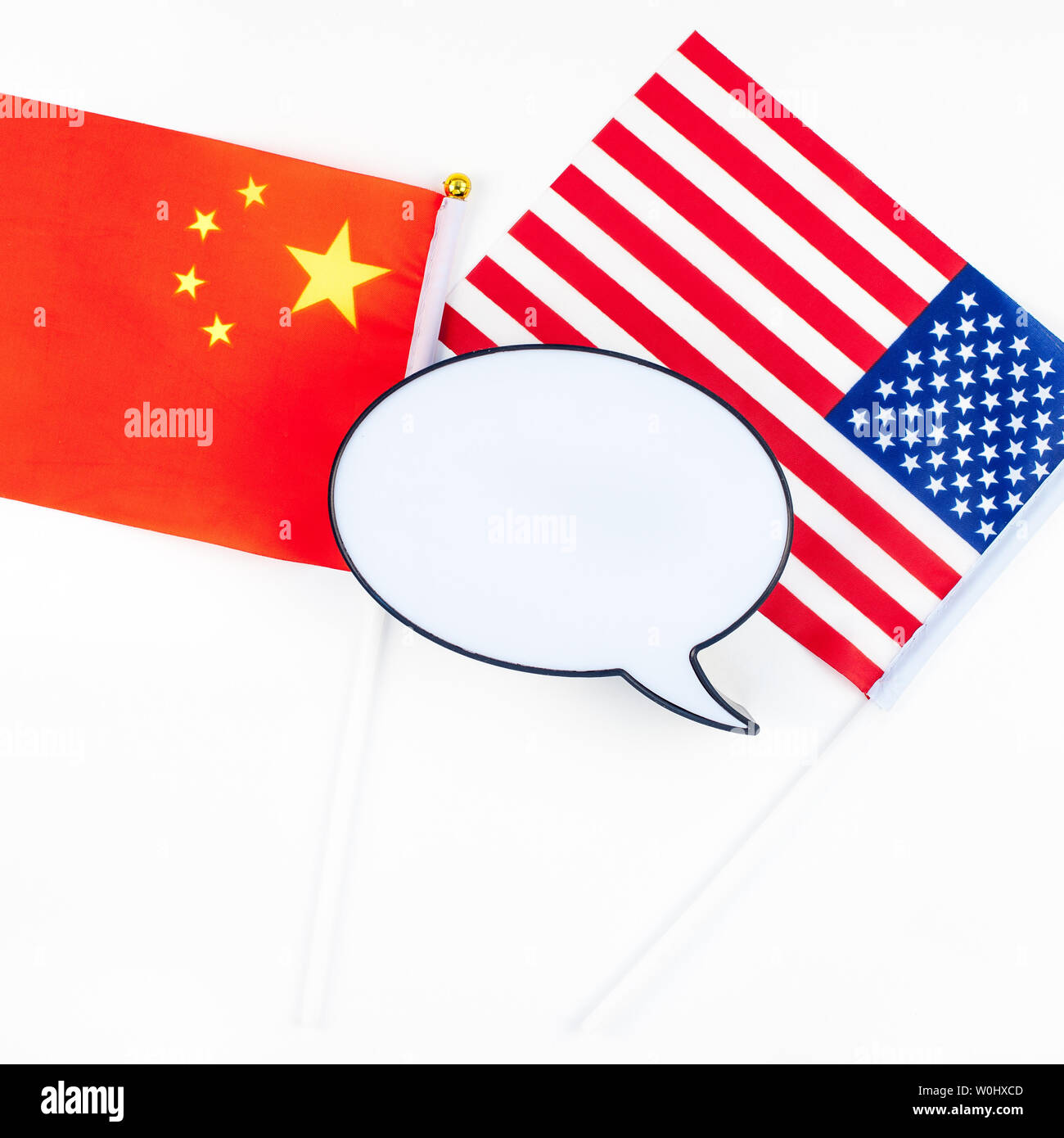 Creative top view flat lay of China and USA flag and empty bubble ...