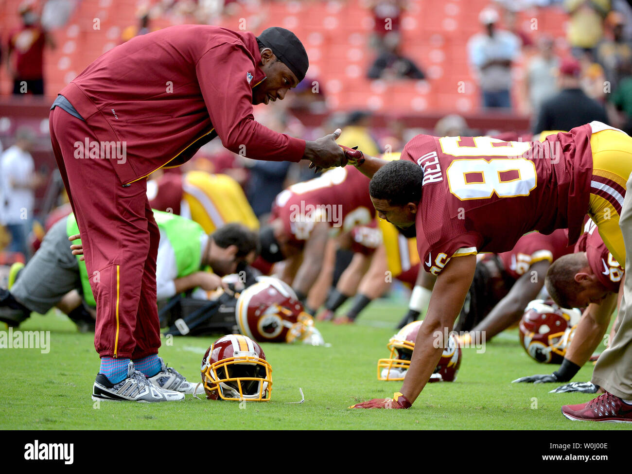 Washington Redskins quarterback Robert Griffin III shakes hands with ...