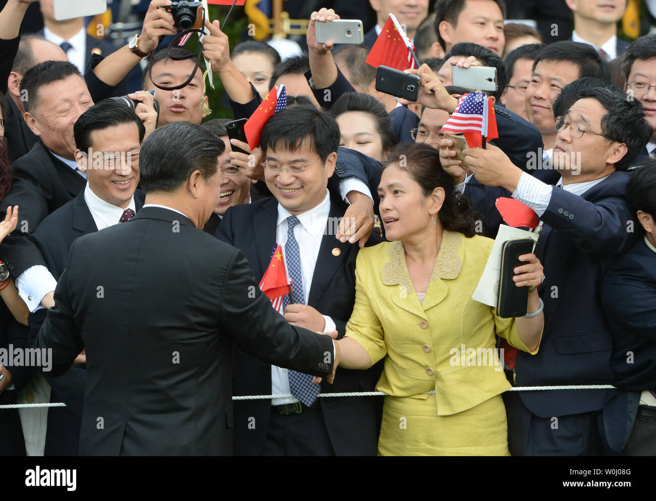 Chinese President Xi Jinping shakes hands to the members of the ...
