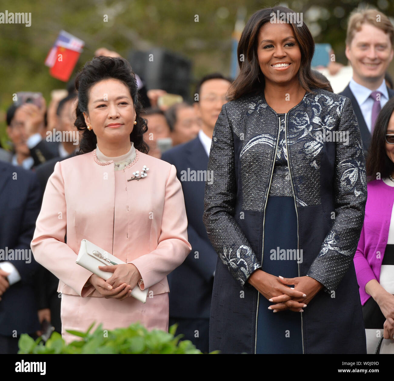 First Lady Michelle Obama (R) stands alongside Chinese First Lady Peng ...