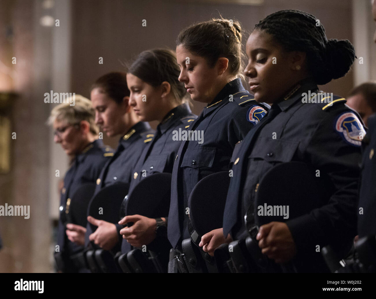 Members of the U.S. Capitol Police Recruit Officer Class 180 stand ...