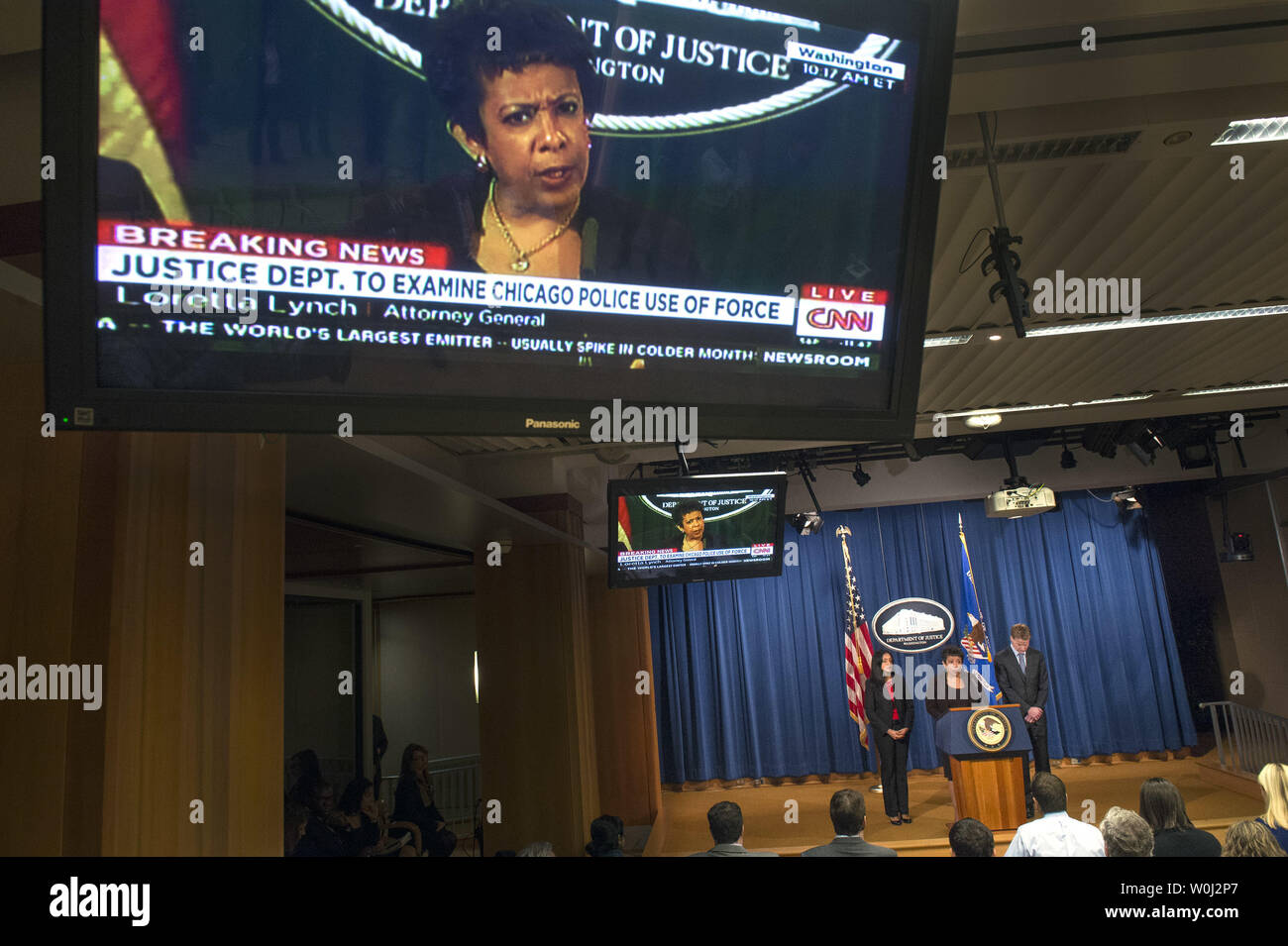 Attorney General Loretta Lynch is seen on a television screen as she ...