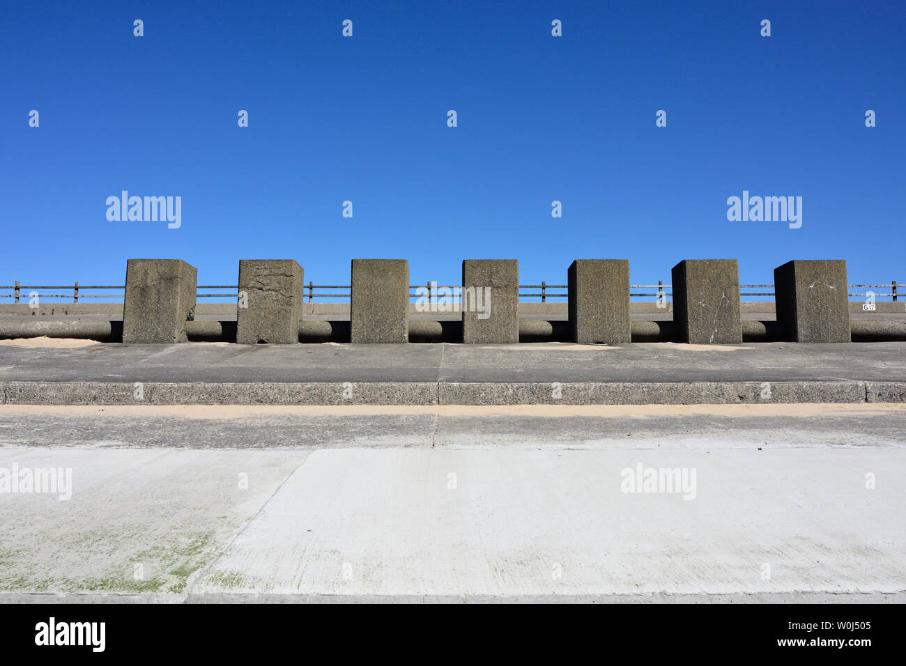 Seawall, concrete sloping revetment and seven concrete columns in ...