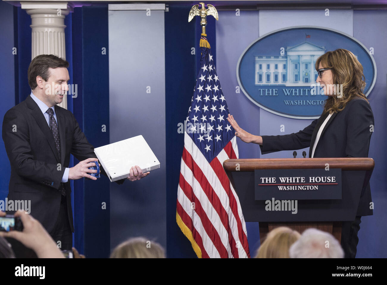 White House Press Secretary Jay Carney (L) jokes with Actress Allison ...