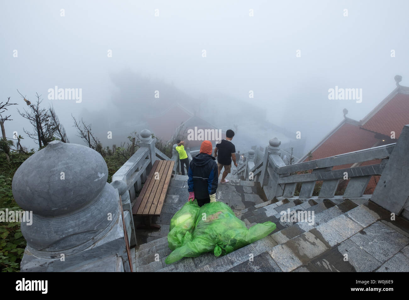 Man trash bag walking hi-res stock photography and images - Alamy
