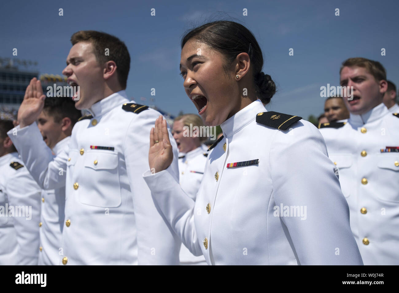 Graduating Midshipmen take the Oath of Office during the 2016 ...