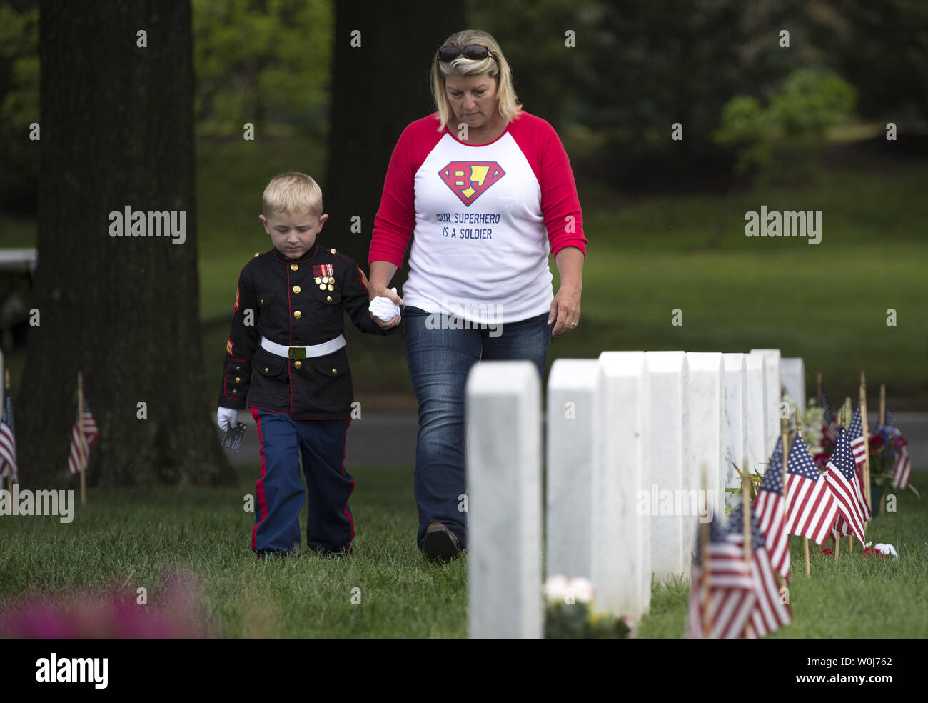 Christian Jacobs, 5, walks with family friend Dianna Beardsley as ...