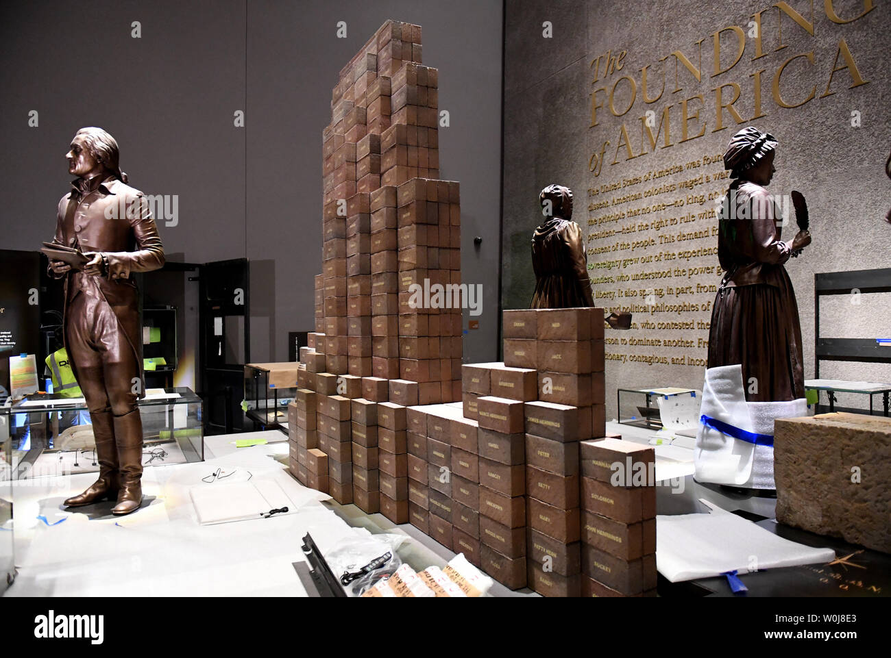 President Thomas Jefferson (L) is shown with a wall of bricks to denote ...