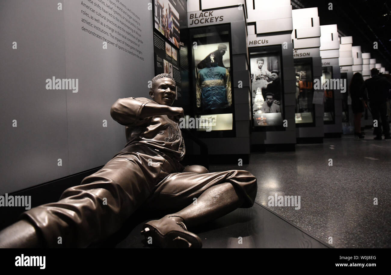 A sculpture of Jackie Robinson is part of the sports exhibit at the ...