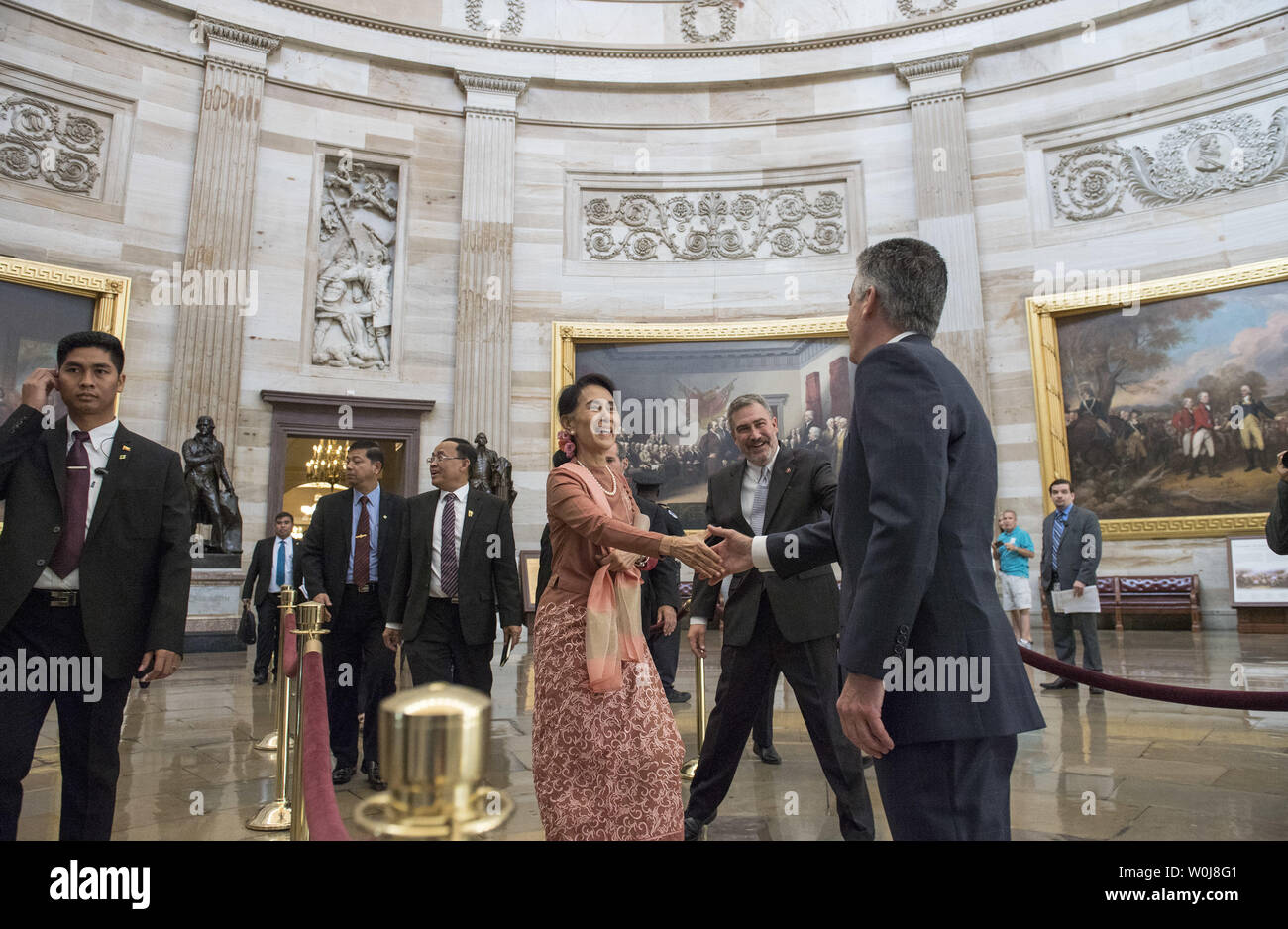 State Counsellor of Myanmar Aung San Suu Kyi (R) walks with Senate ...