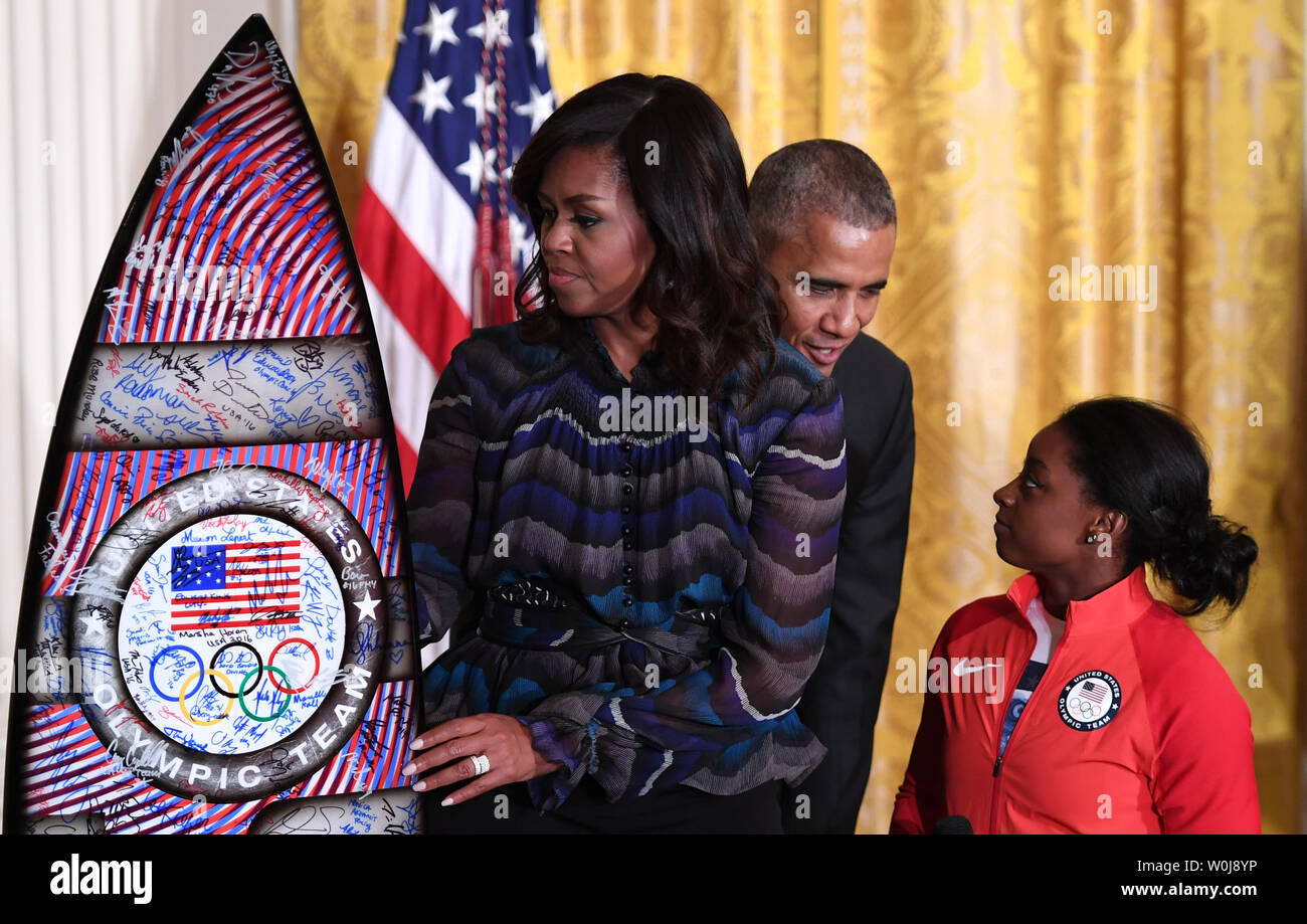 U.S. President Barack Obama and first lady Michelle Obama are presented ...