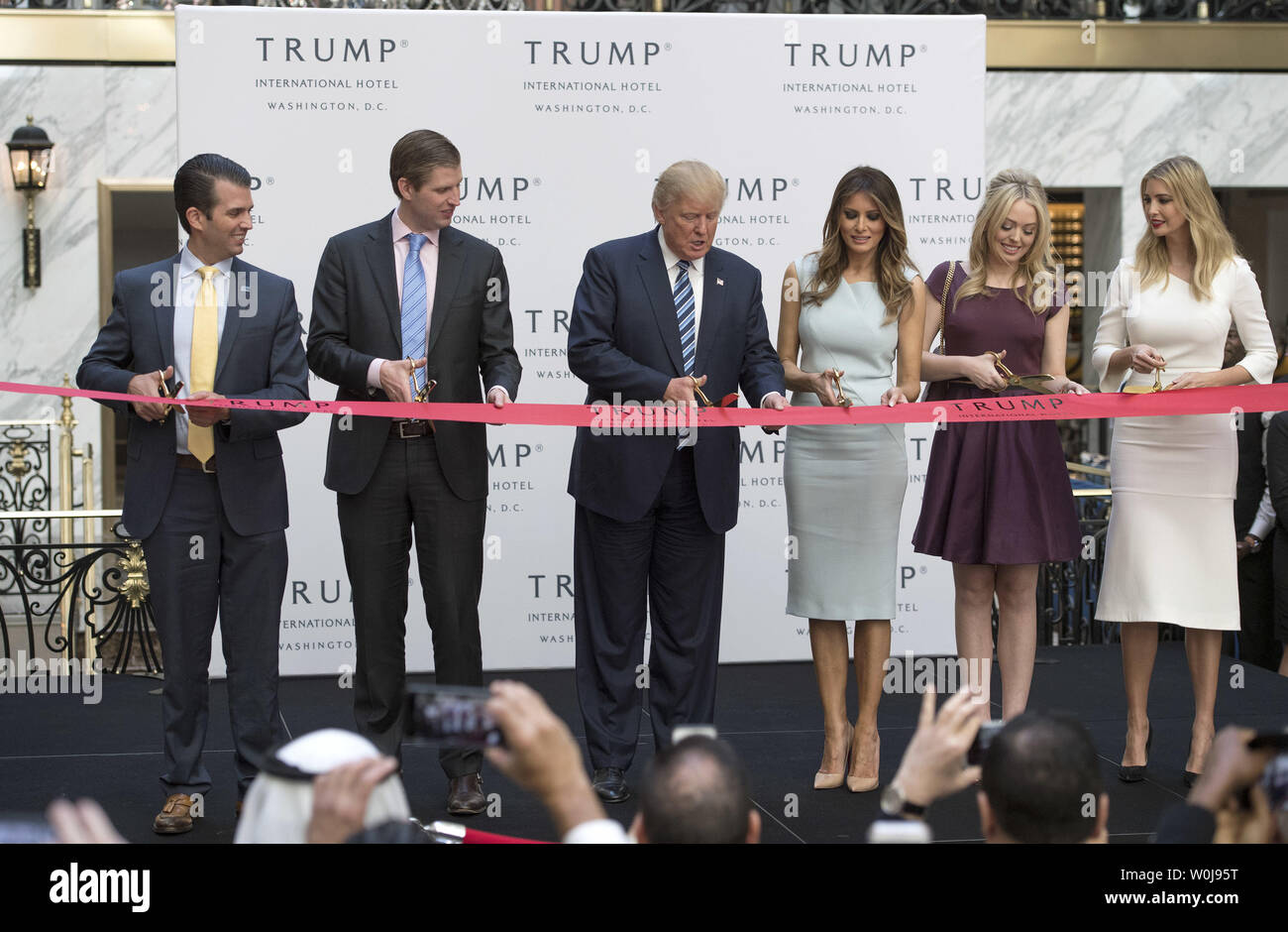 Republican presidential candidate Donald Trump (3rd-L), joined by his ...