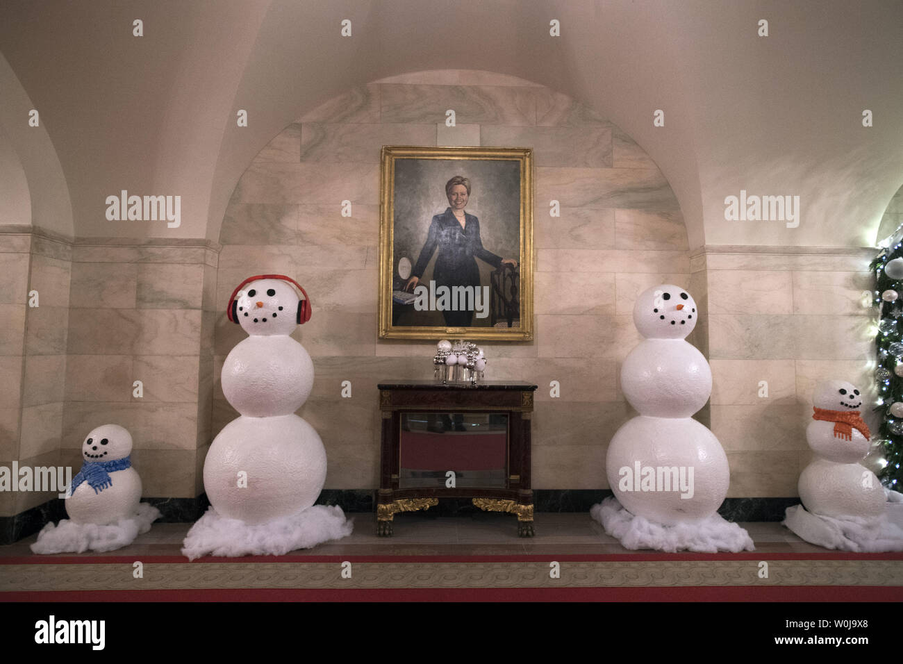 A portrait of former First Lady Hillary Clinton is seen alongside ...