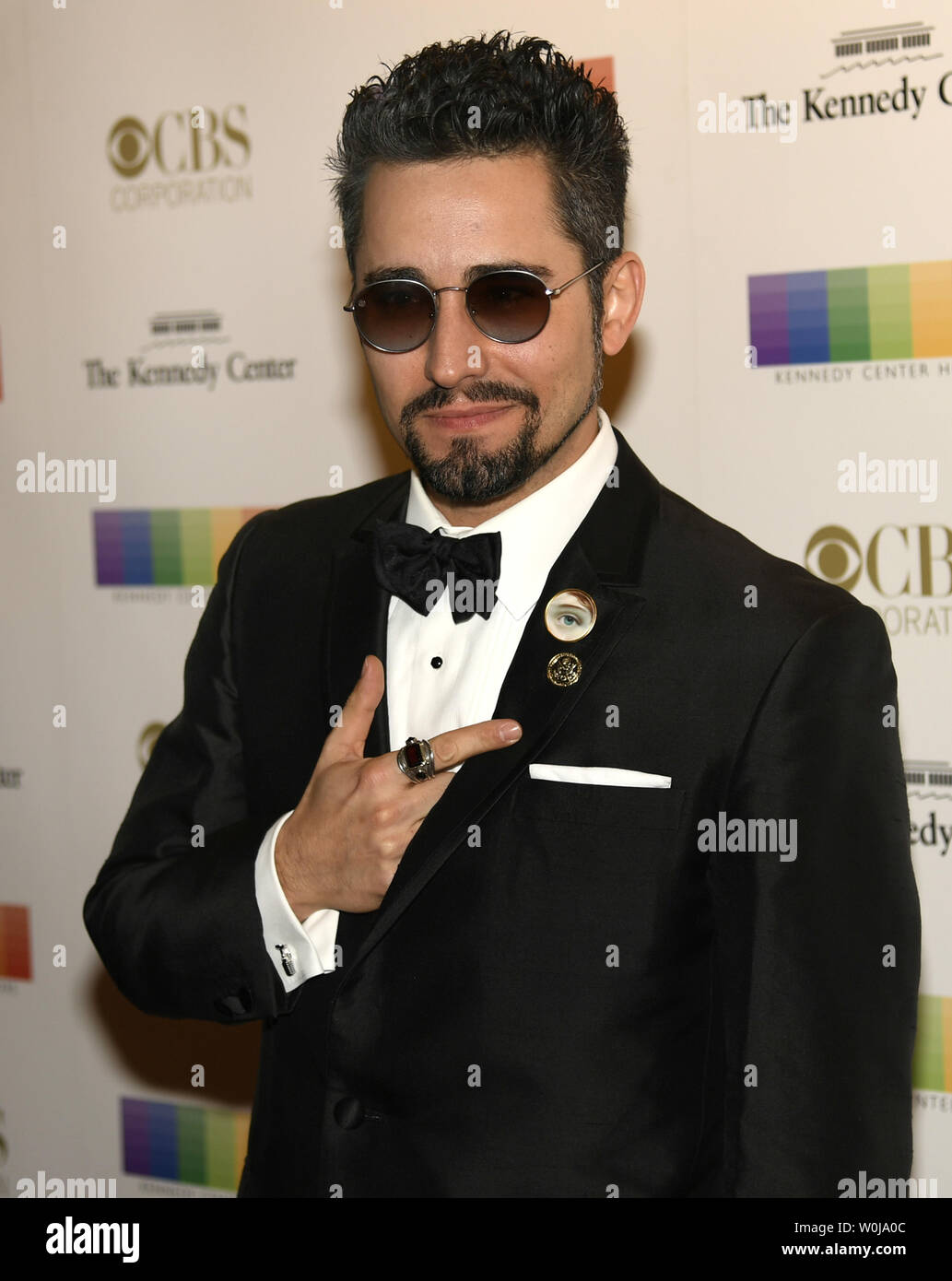 Actor and singer John Lloyd Young poses for photographers as he arrives ...