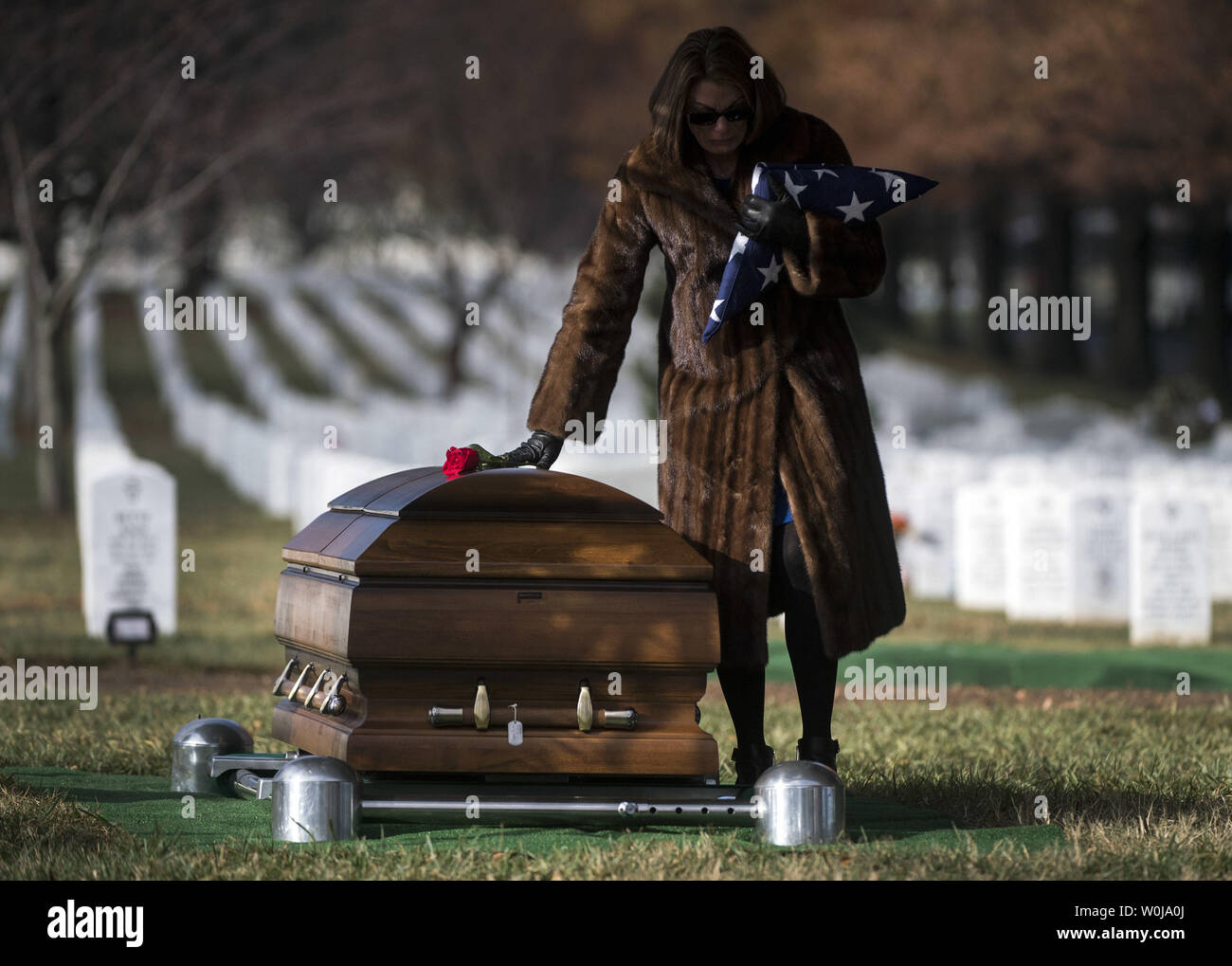 Lisa Frost mourns at the casket containing the remains of her son, Army ...