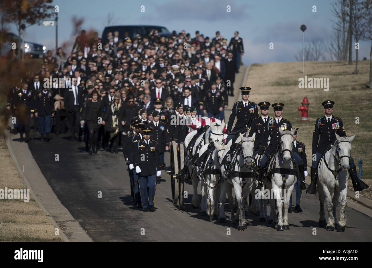 A caisson carries the remains of Army Staff Sergeant James Moriarty ...