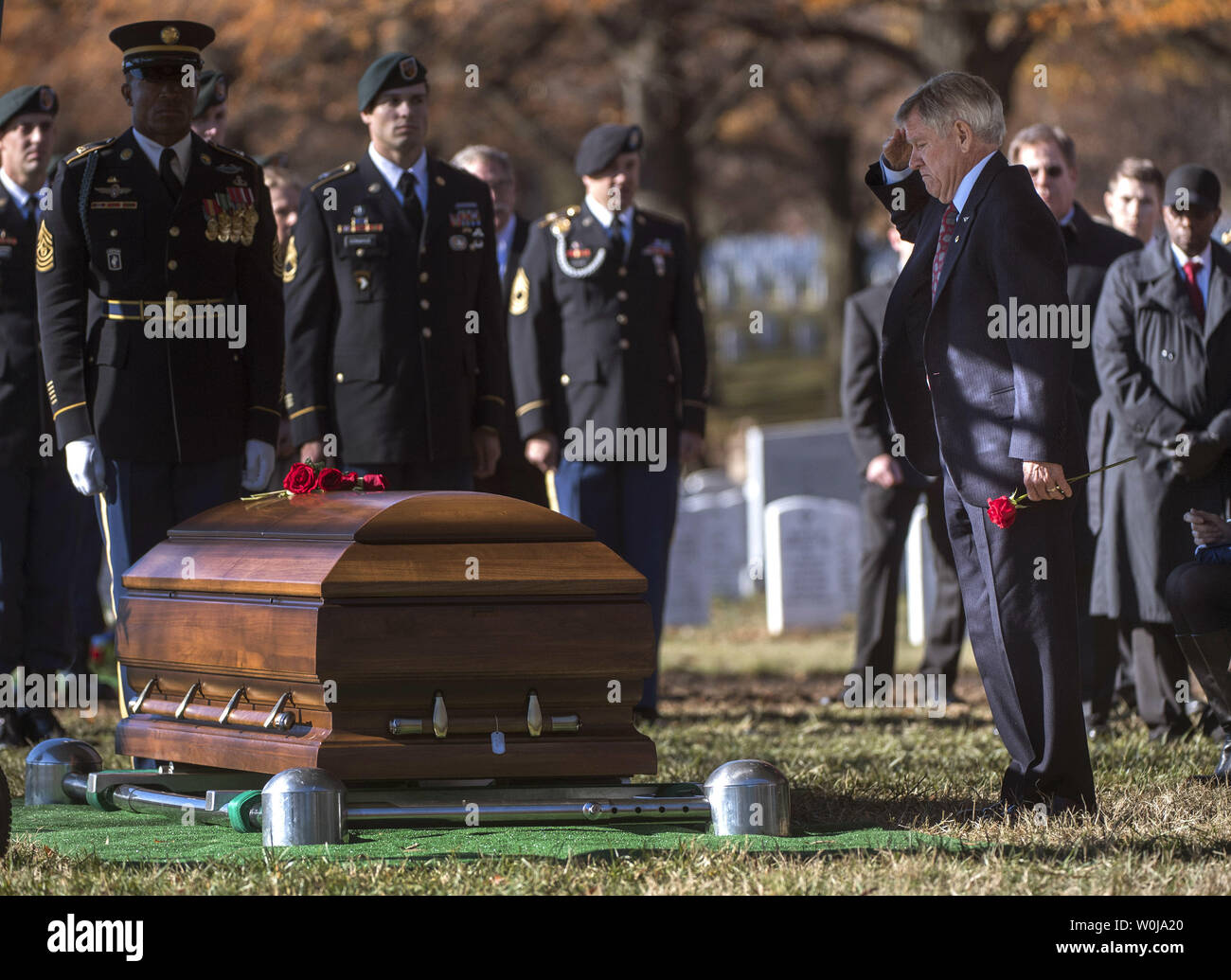 James Moriarty salutes the casket continuing the remains of his son ...