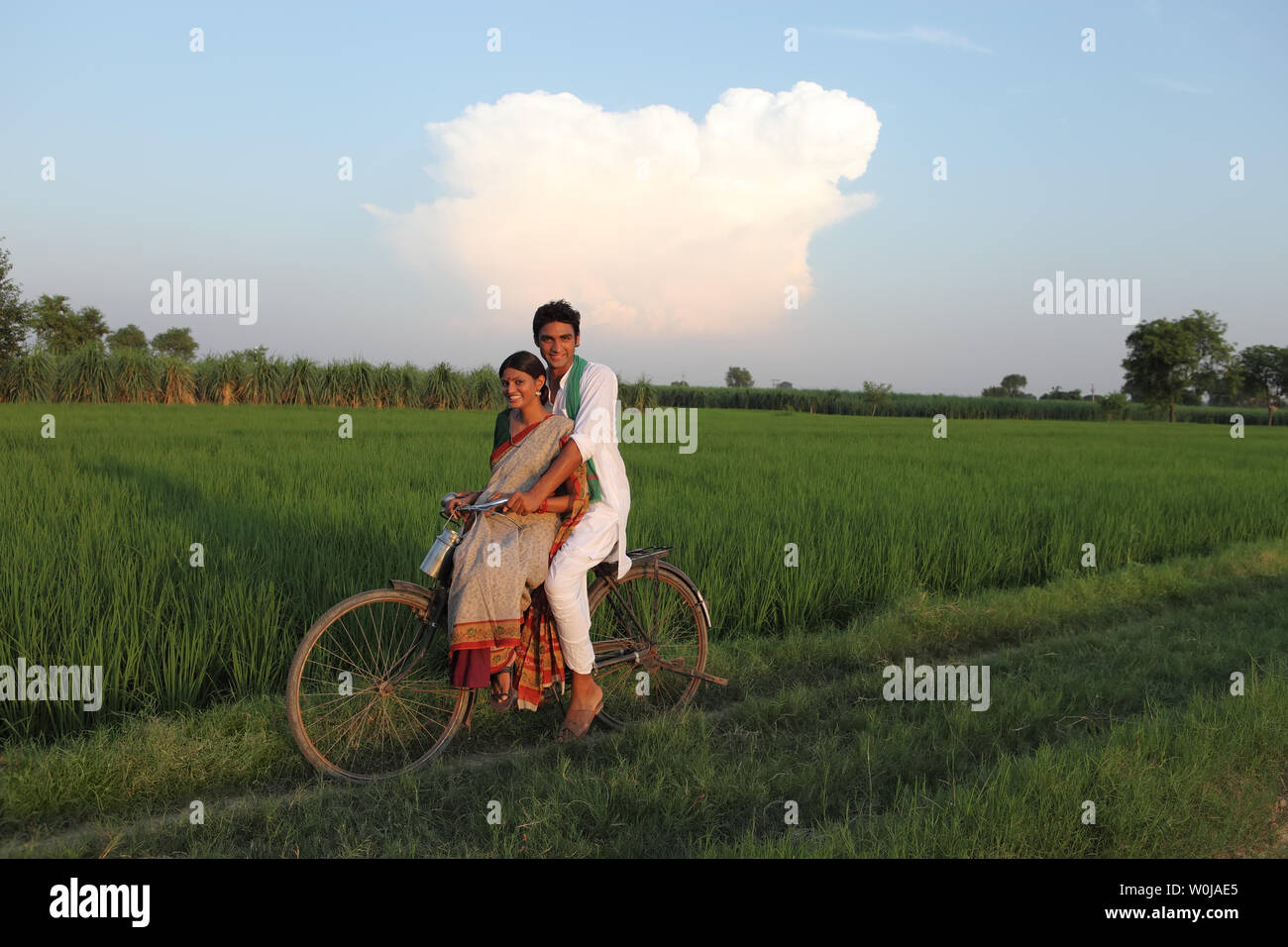 Couple riding bicycle india hi-res stock photography and images - Alamy