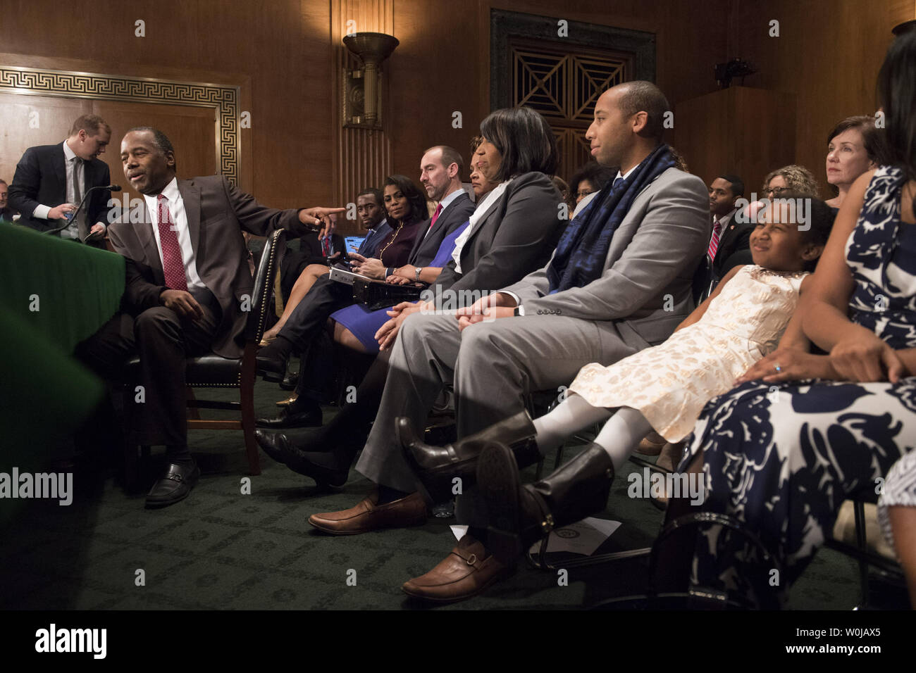 Ben Carson introduces his family before testifying during his Senate ...