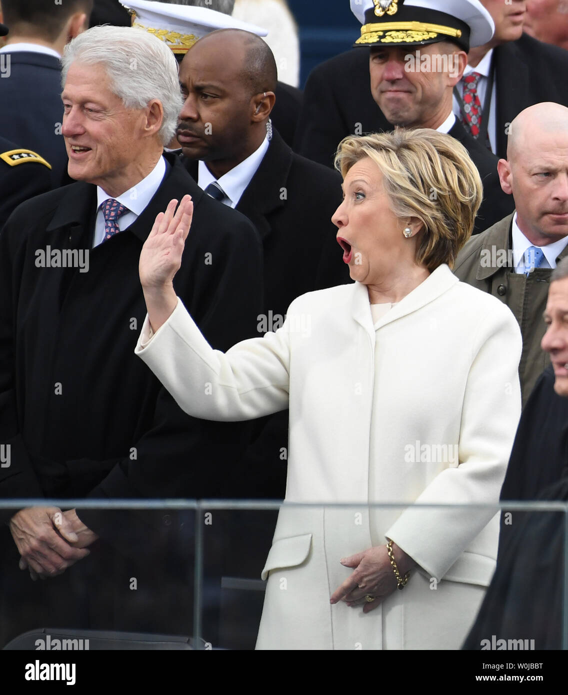 Former President Bill Clinton (L) and Hillary Clinton greet guests at ...