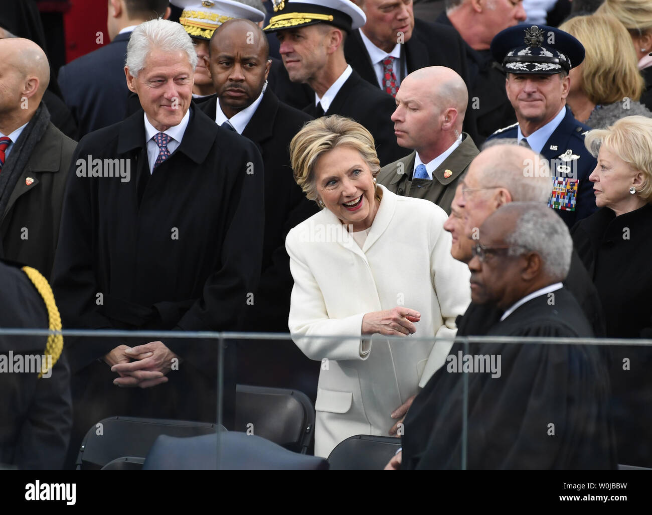 Former President Bill Clinton (L) and Hillary Clinton greet guests at ...